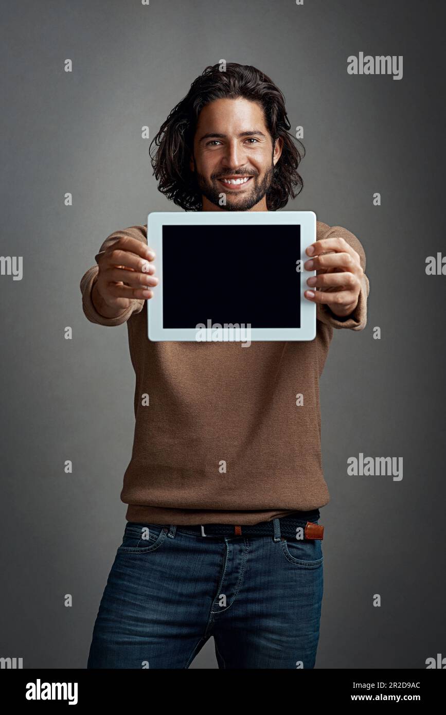 Portrait, tablet screen and happy man with mockup in studio isolated on ...