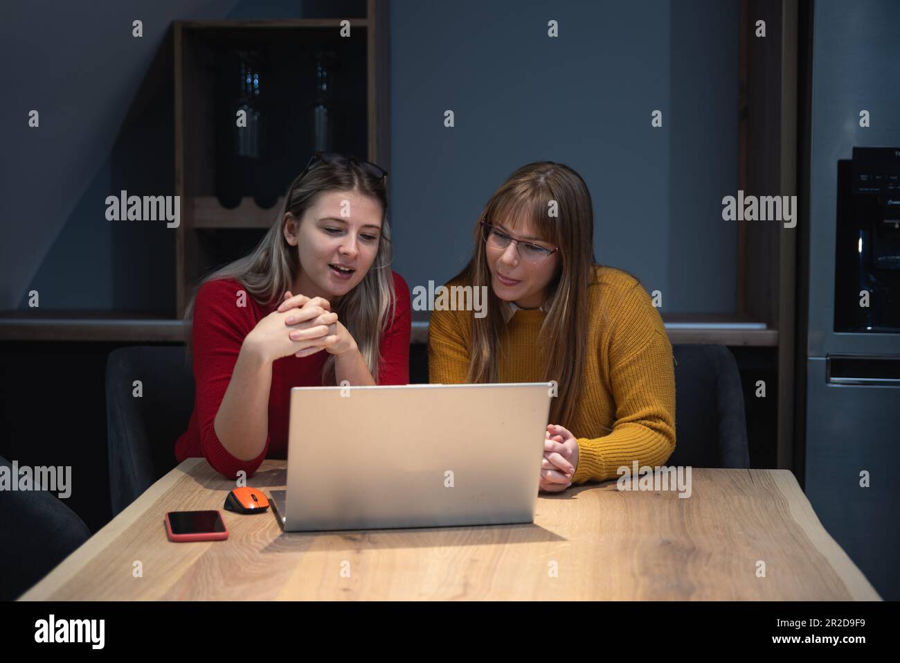 Two Happy Ladies Using Laptop Computer Working And Learning Online ...