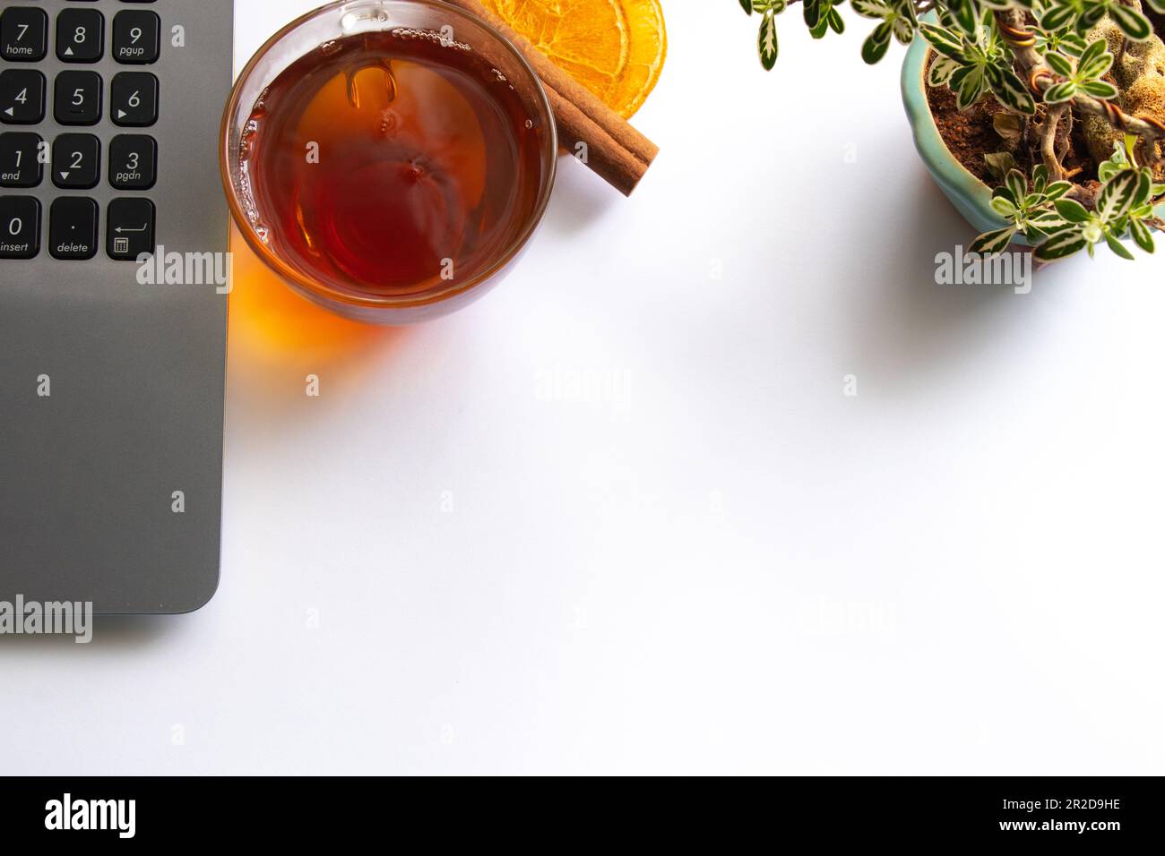 laptop computer and notebook and tea on a white background, in the ...