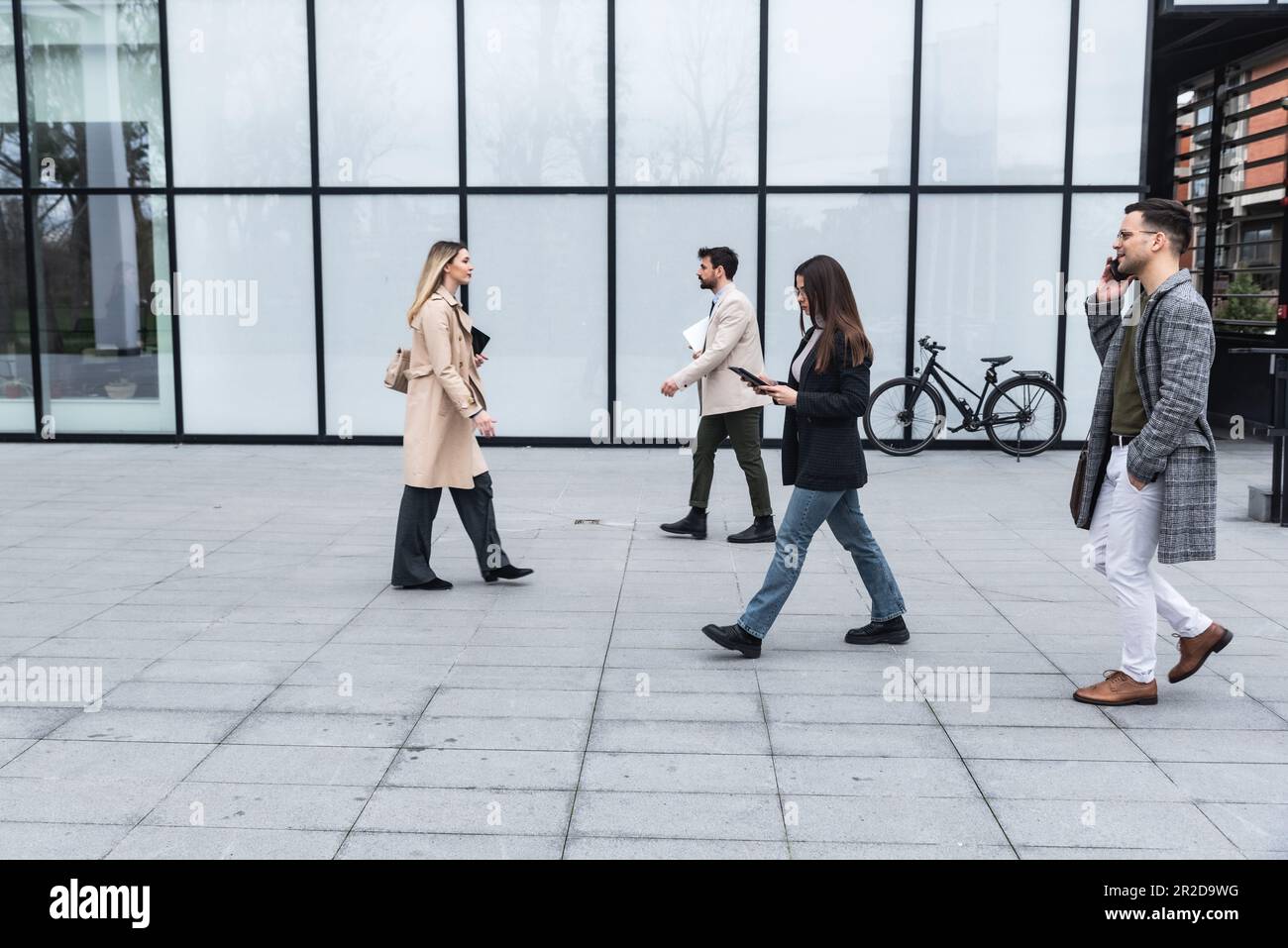 Think different concept. Group of business people in front of office ...