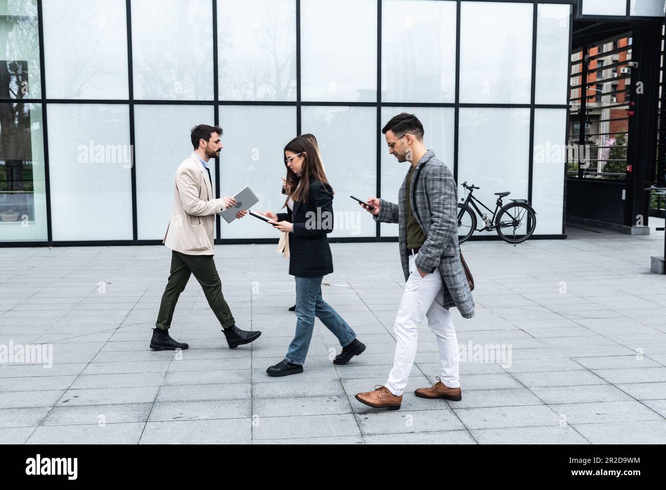 Think different concept. Group of business people in front of office ...