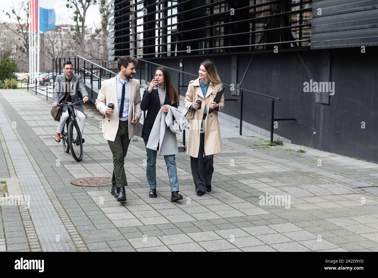 A regular day for working people standing talking walking in front of ...