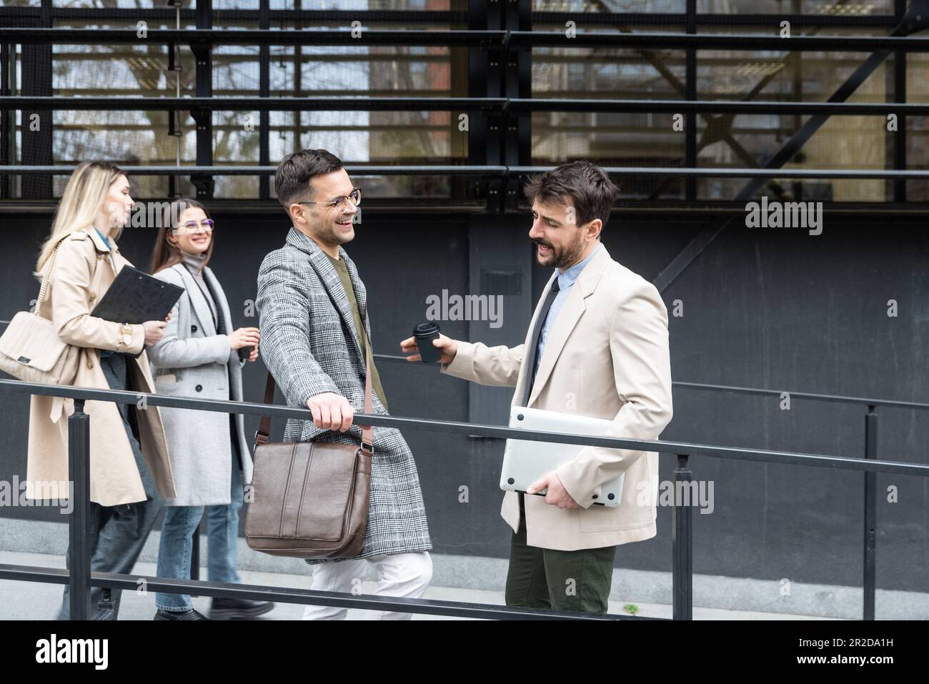 A regular day for working people standing talking walking in front of ...