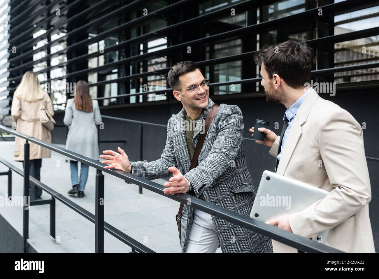 Quick briefing before meeting. Group of cheerful young successful ...