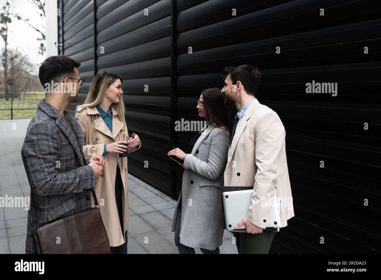 Business team colleagues partners standing in front of office building ...