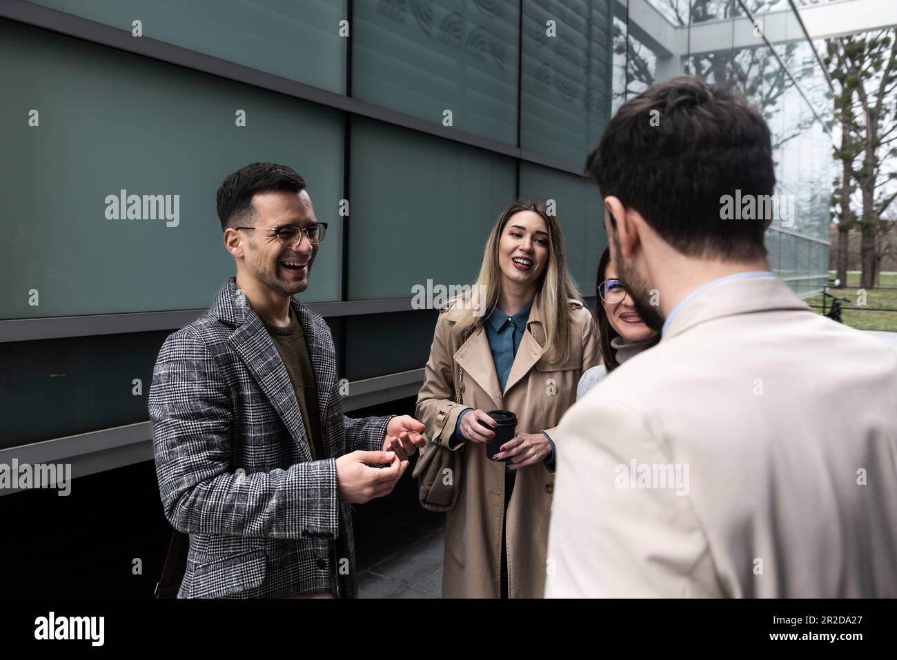 Business team colleagues partners standing in front of office building ...