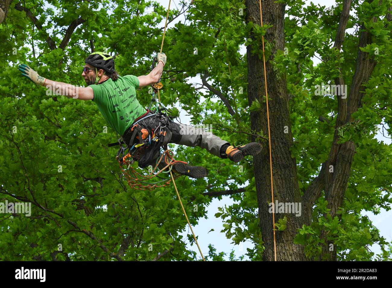 19 May 2023, Saxony-Anhalt, Schönebeck: Climber Fabian Gäckle swings ...