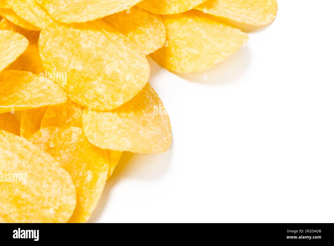 yellow potato chips isolated on white Stock Photo - Alamy
