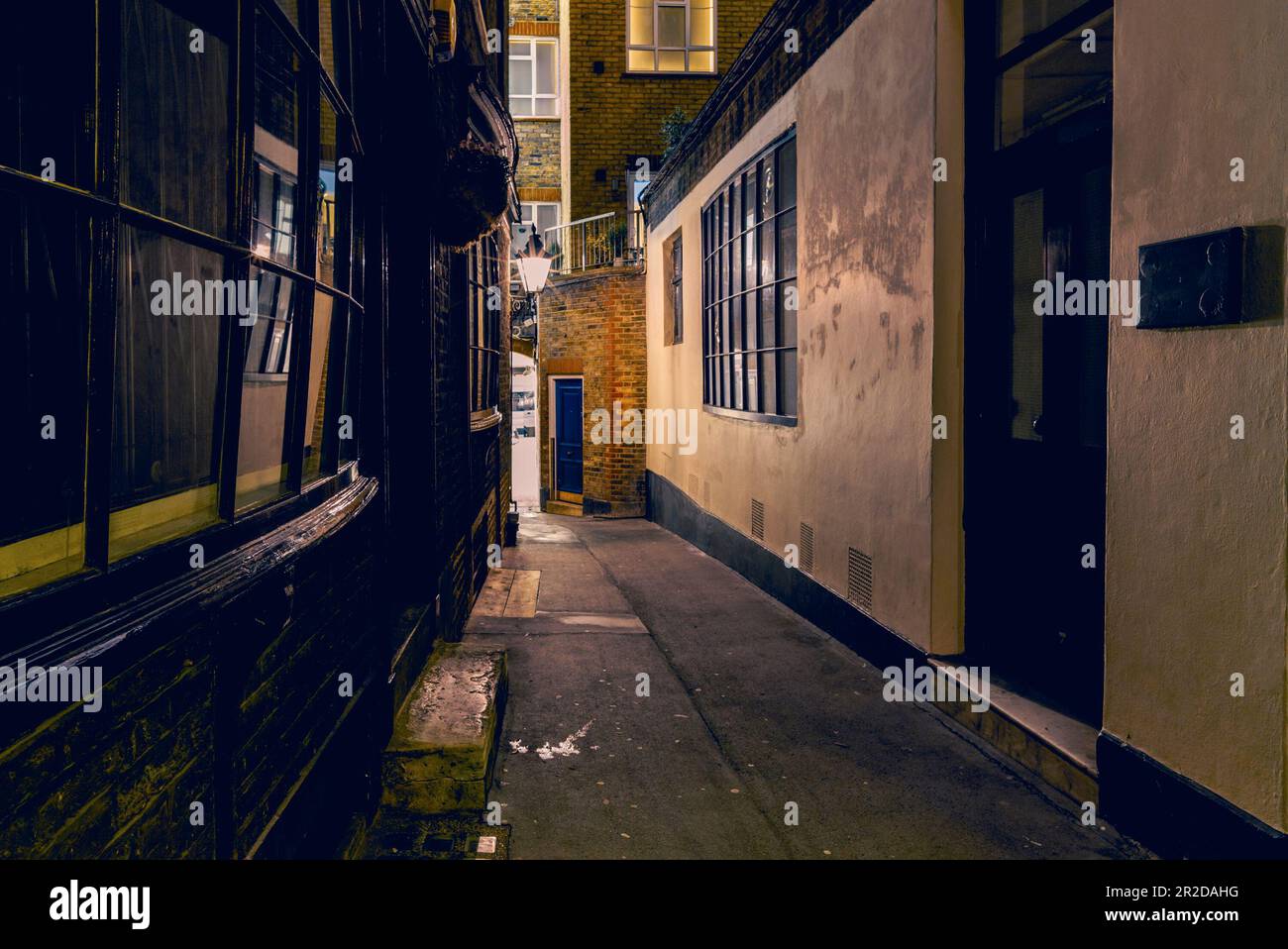 A mysterious and hidden old back alley in London at night Stock Photo ...