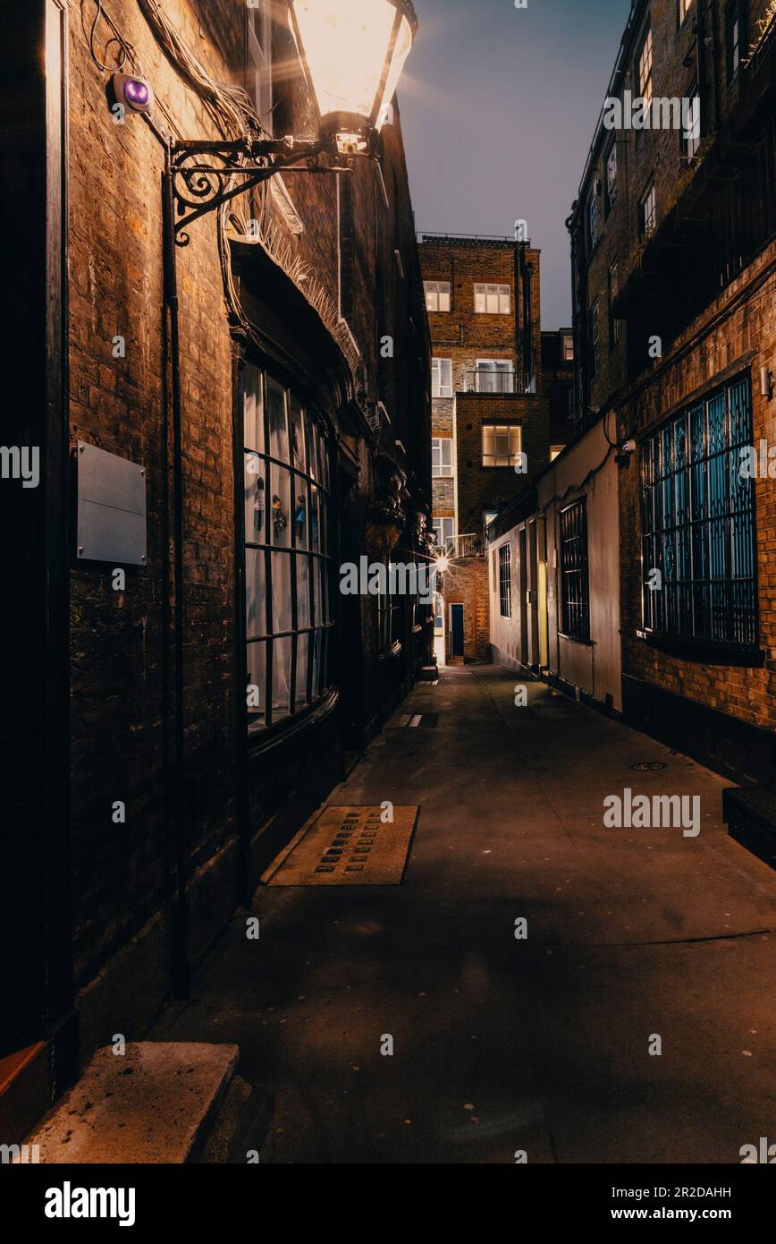 A mysterious and hidden old back alley in London at night Stock Photo ...