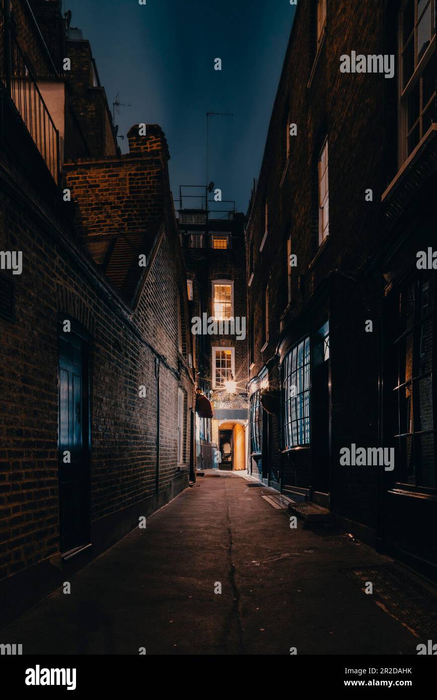 A mysterious and hidden old back alley in London at night Stock Photo ...