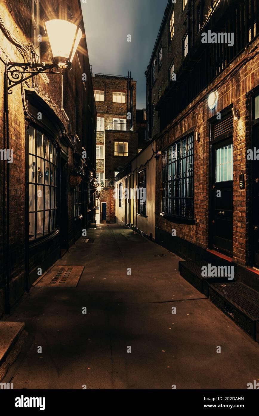 A mysterious and hidden old back alley in London at night Stock Photo ...