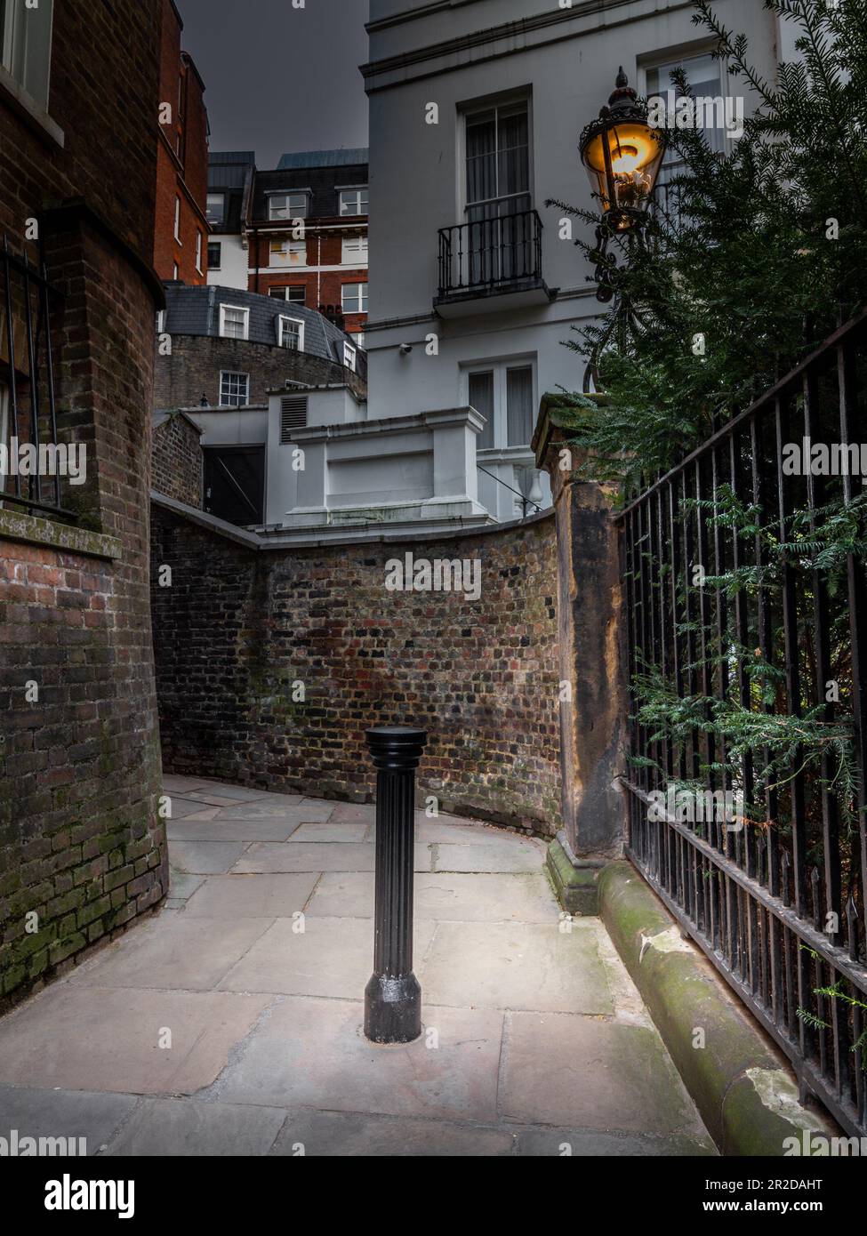 A mysterious and hidden old back alley with staircase in London at ...
