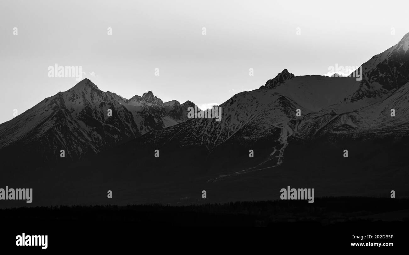 Snow covered mountains peaks, Black and white Stock Photo - Alamy
