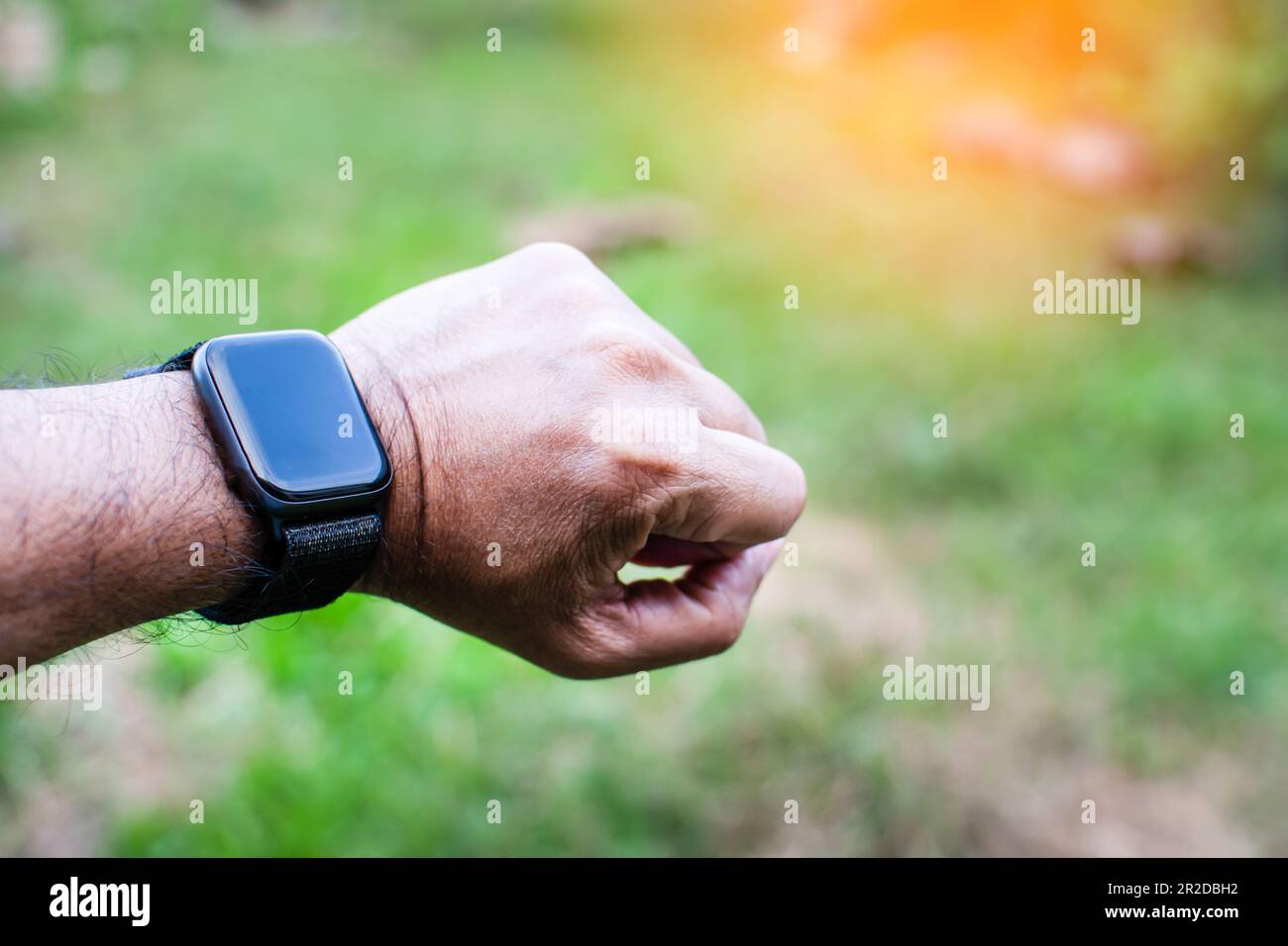 Black smartwatch on the men's left wrist to watch while exercising from ...