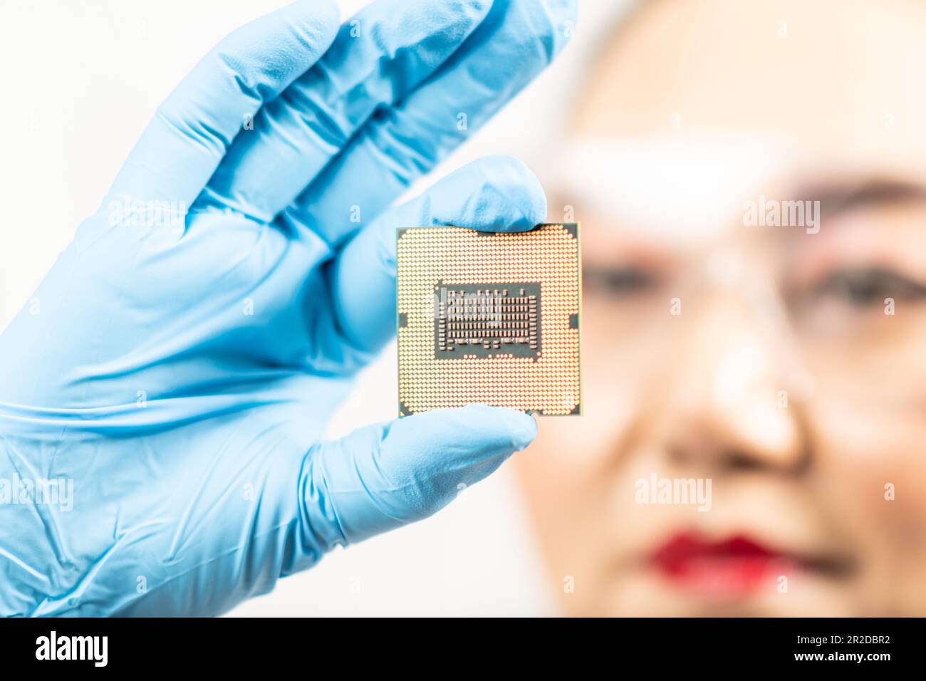Technician examines chips electronic device hi-res stock photography ...