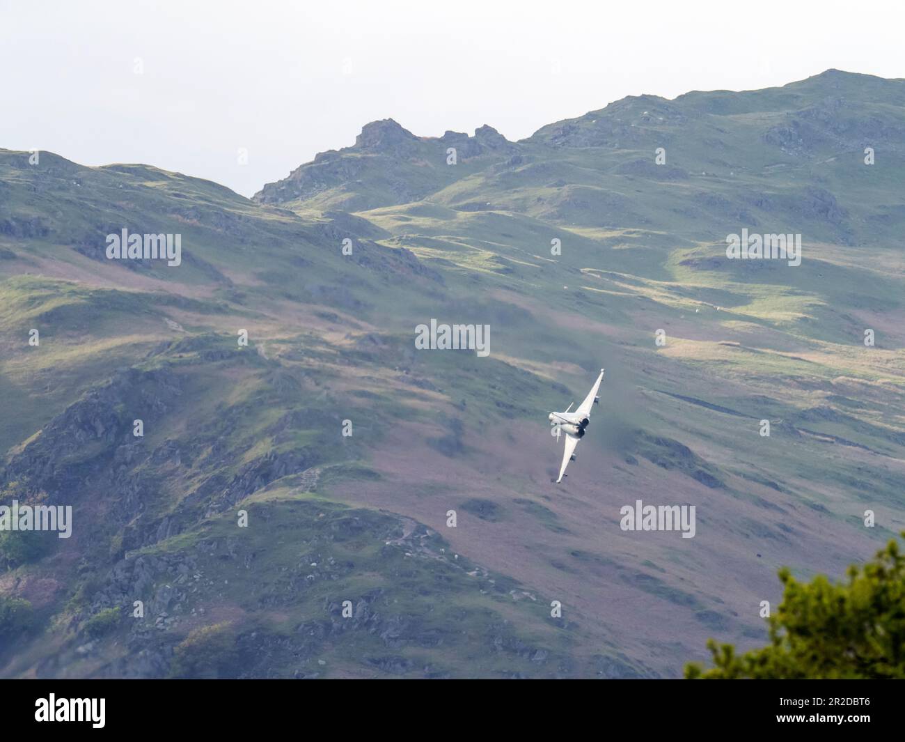 An RAF fighter jet practising low flying over Ambleside, Lake District ...