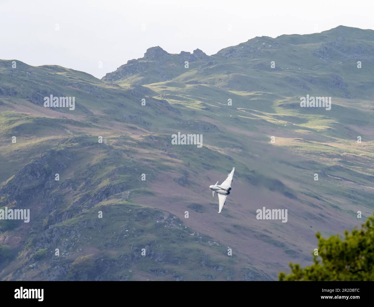 An RAF fighter jet practising low flying over Ambleside, Lake District ...