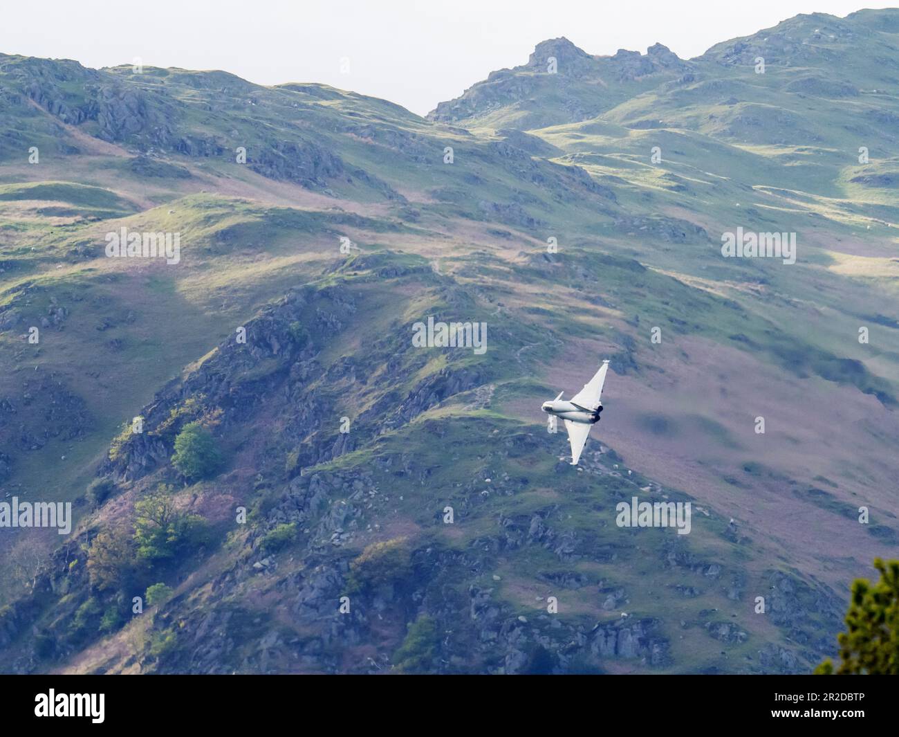 An RAF fighter jet practising low flying over Ambleside, Lake District ...