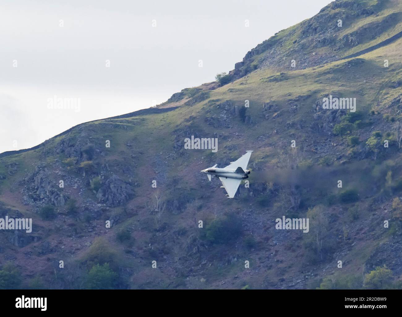 An RAF fighter jet practising low flying over Ambleside, Lake District ...