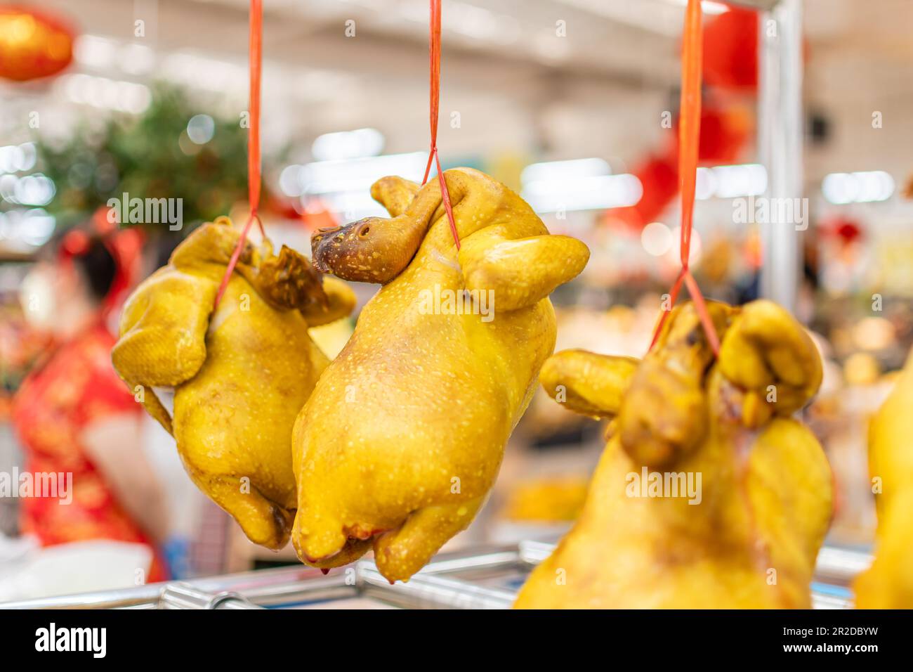 Boiled chicken and hung with ropes for sale to Chinese to pay homage to ...