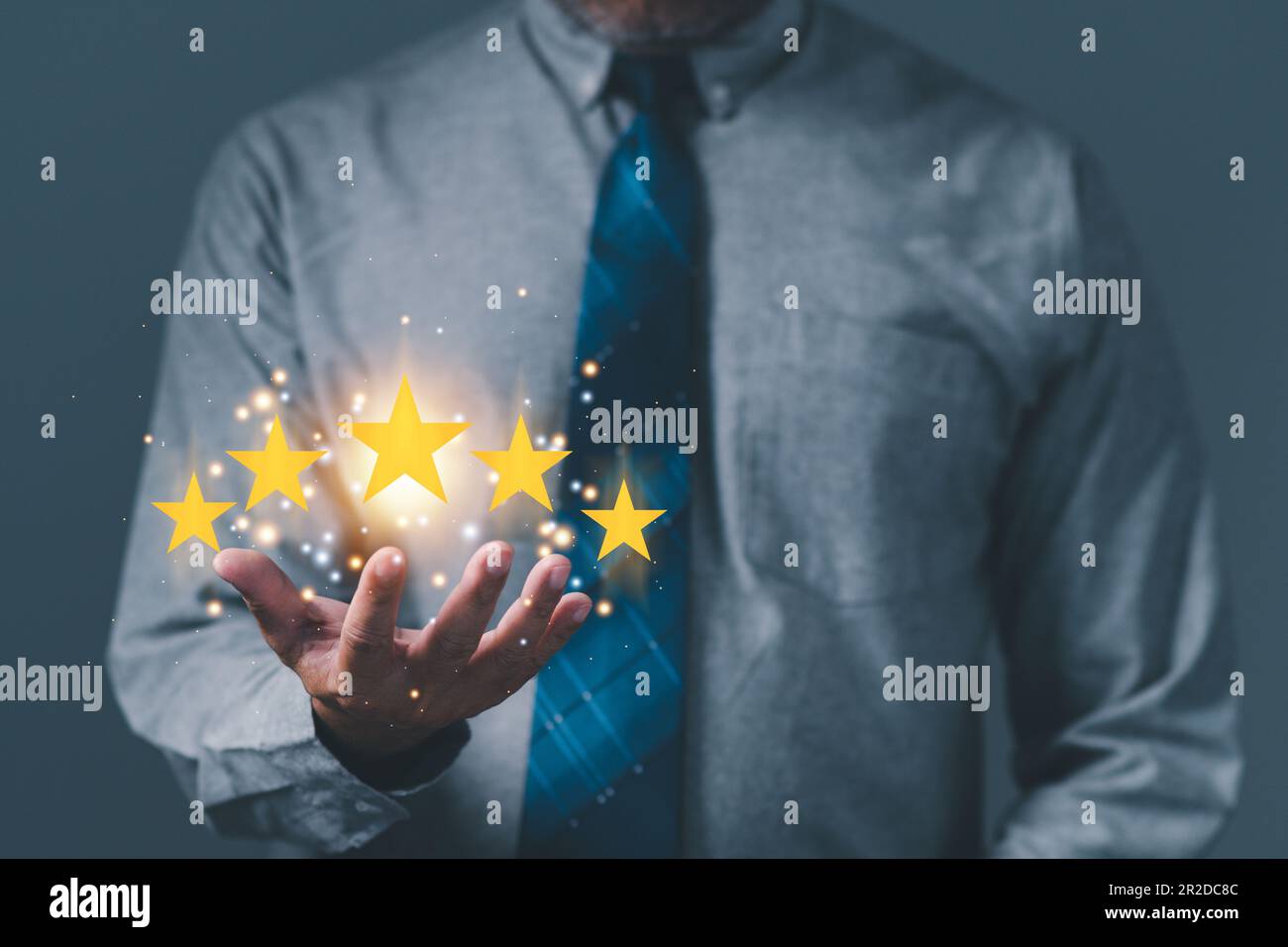 hand of customer or businessman holding stars to complete five stars ...