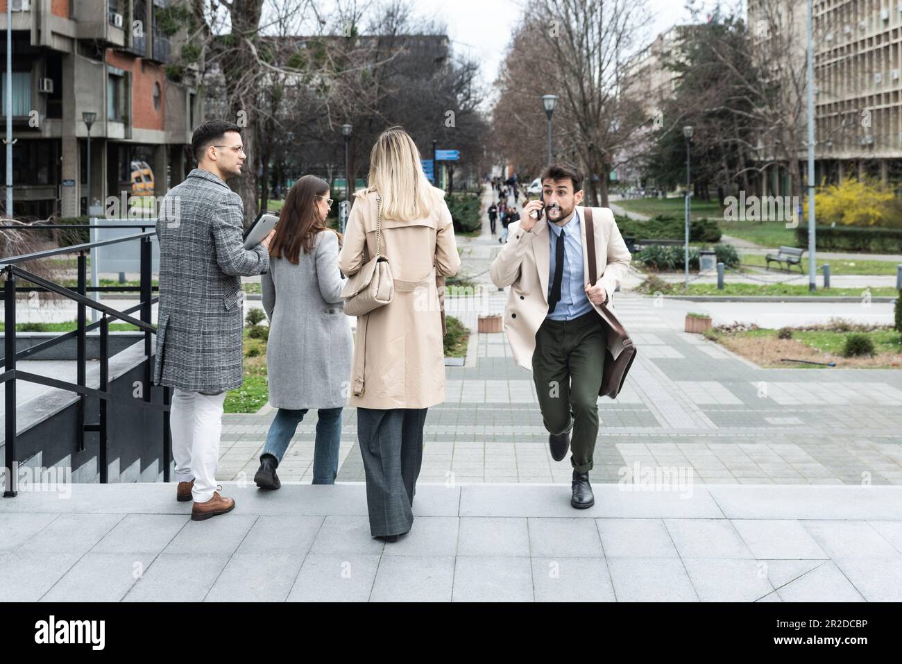 Hurrying into office building hi-res stock photography and images - Alamy