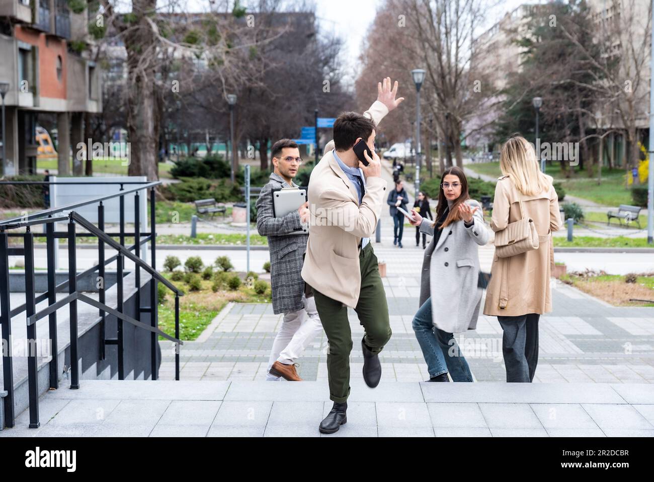 Young business man running up the stairs late for work and job ...
