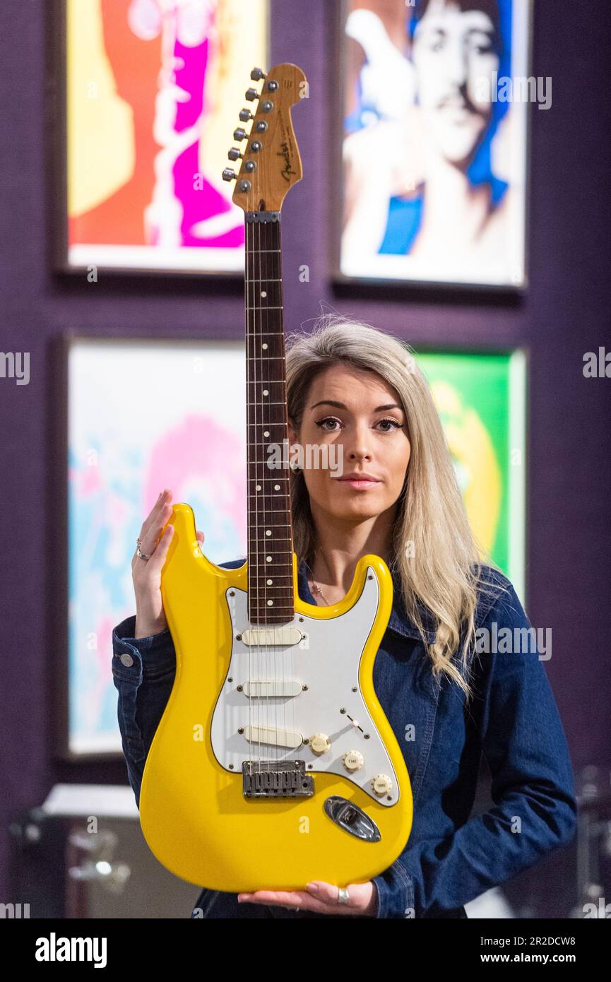 London, UK. 19 May 2023. A staff member with ‘A graffiti yellow working ...