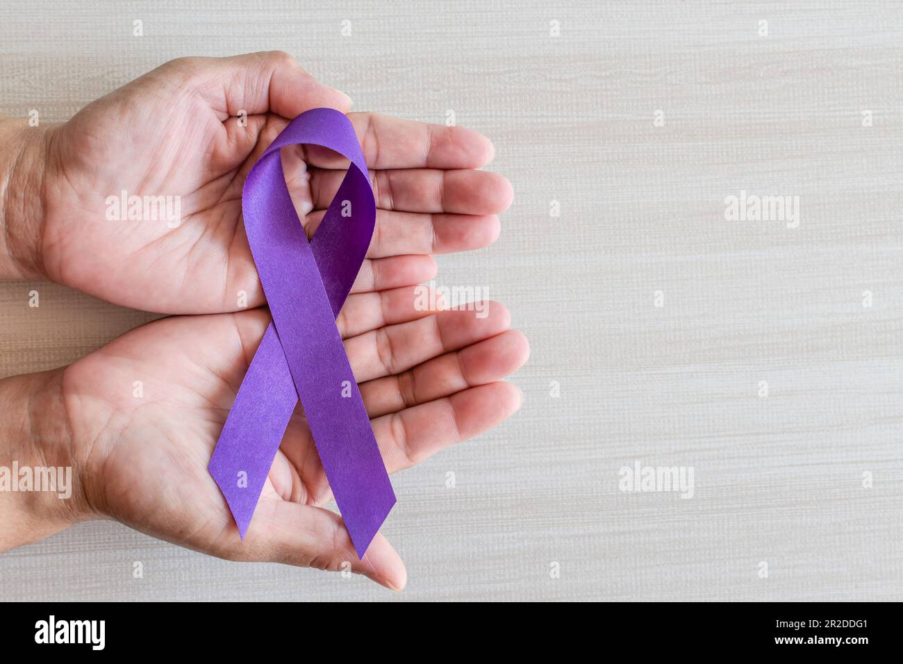 International Overdose Awareness Day, hand holds purple awareness ...