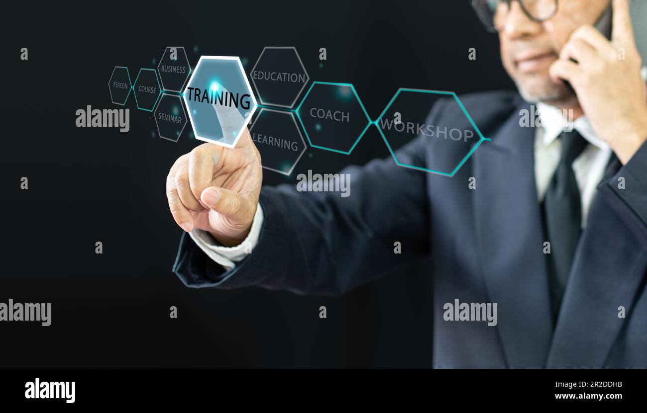 professional businessman click a training button on a virtual screen ...