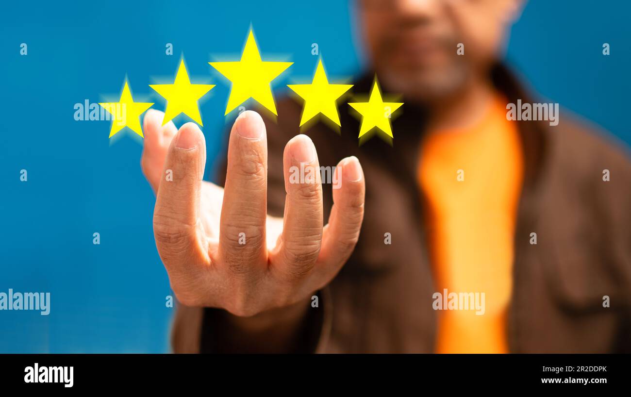 hand of customer or businessman holding stars to complete five stars ...
