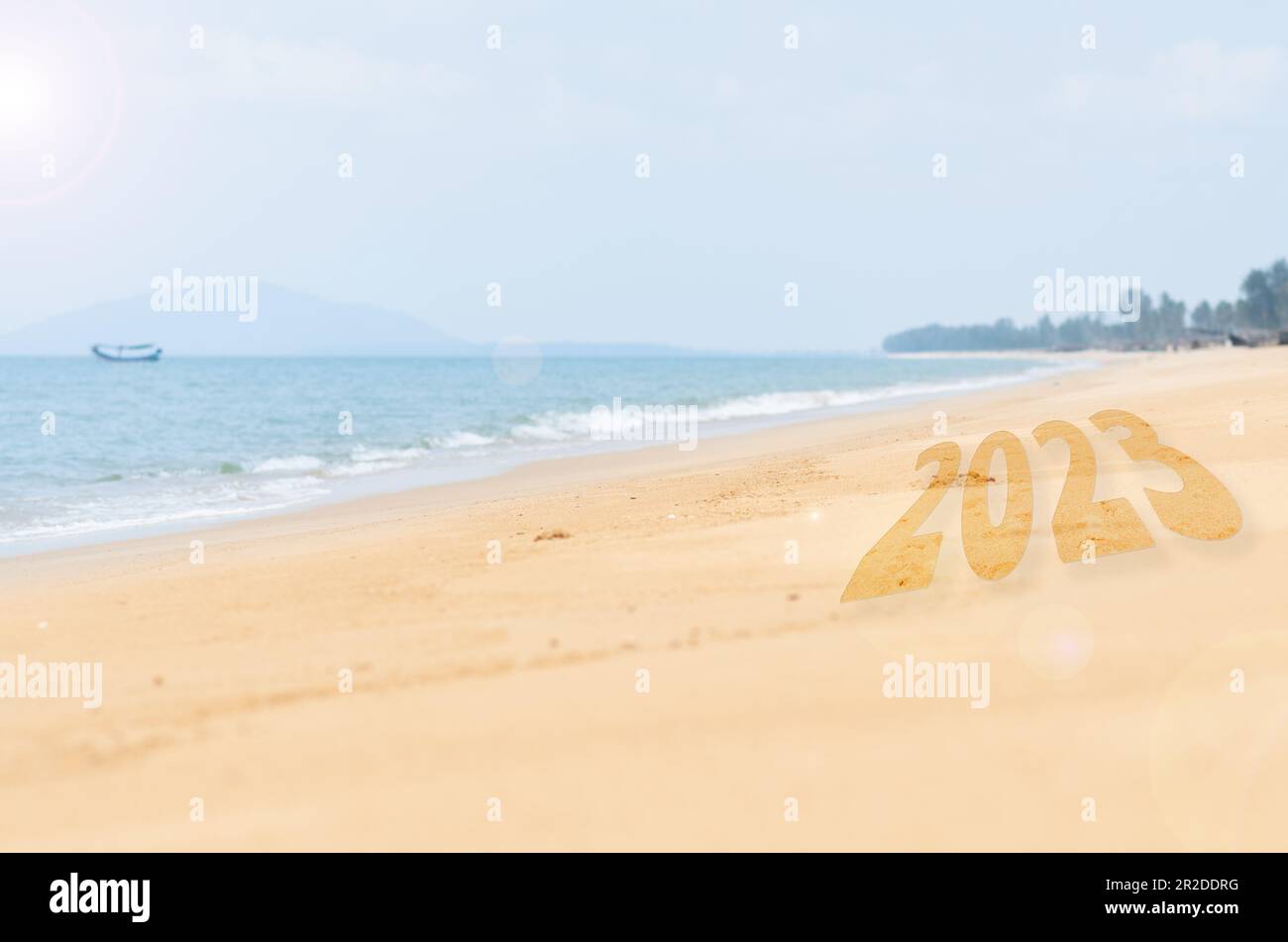 New Year 2023 Concept. inscription is a 2023 number on sand beach ...