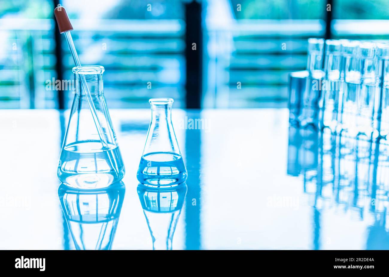 Chemistry experiment concept in science laboratory Two science flasks ...