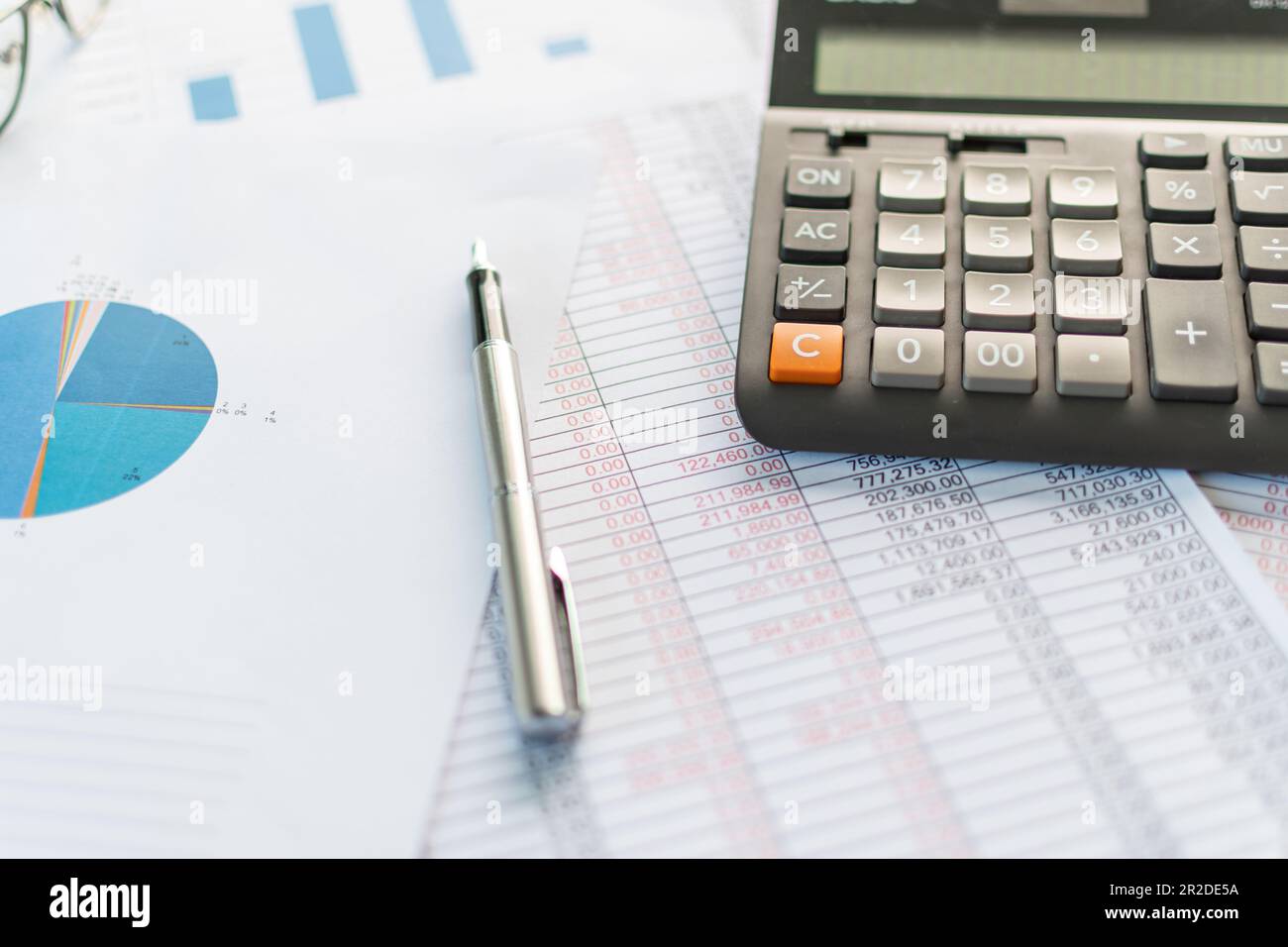 financial accounting, work from home, closeup calculator on desktop ...