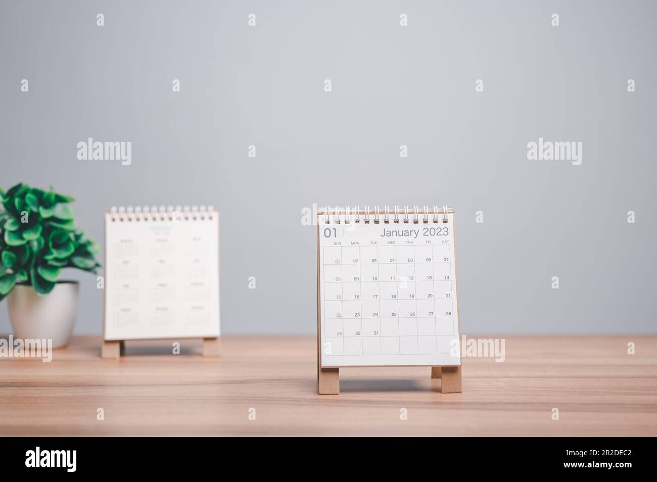 Desktop calendar for 2023 on a desk beige and white background. plans ...