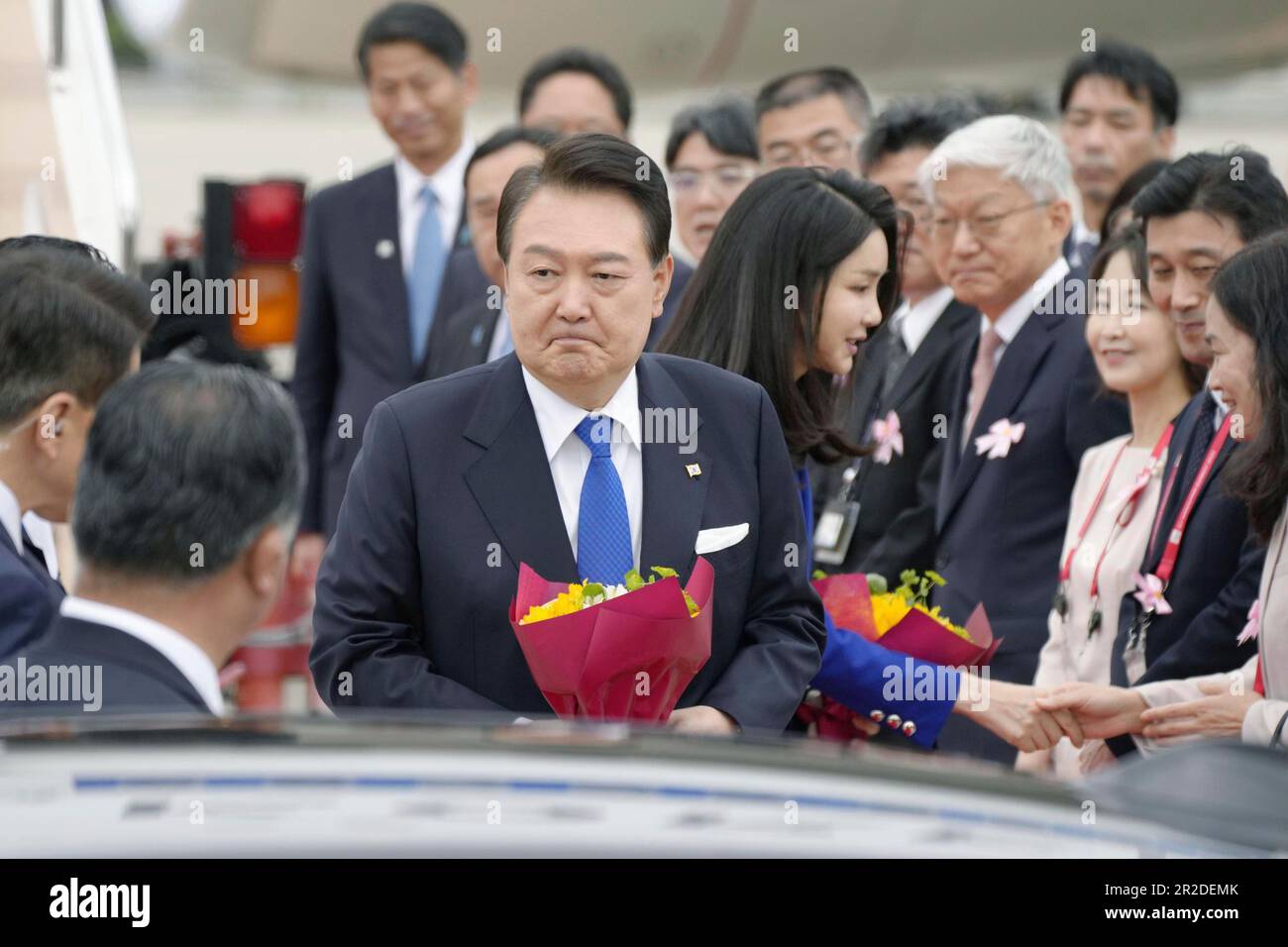 South Korean President Yoon Suk Yeol, center left, and his wife Kim Keon Hee, center right, are ...