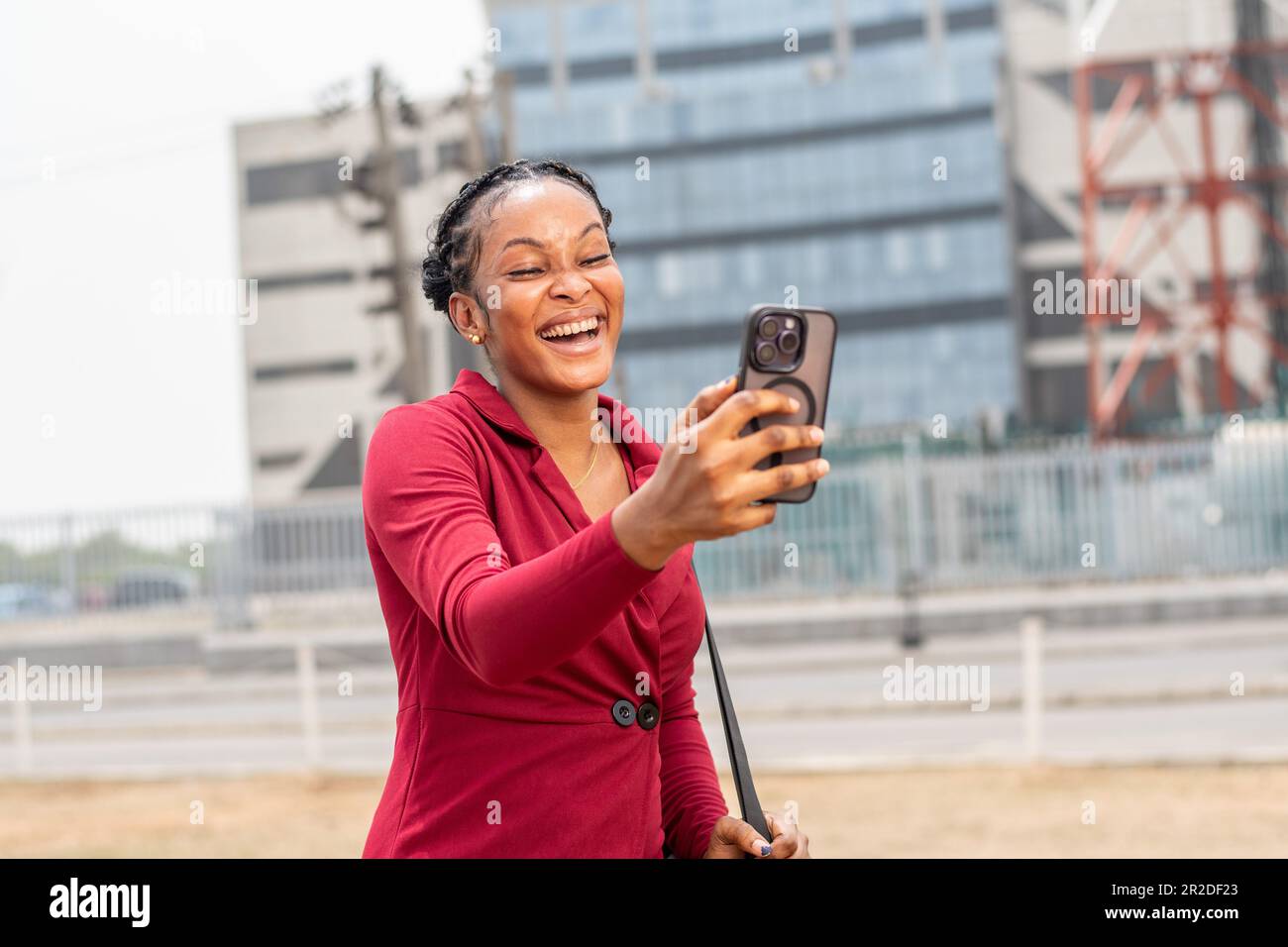 Cheerful african lady holding hi-res stock photography and images - Alamy