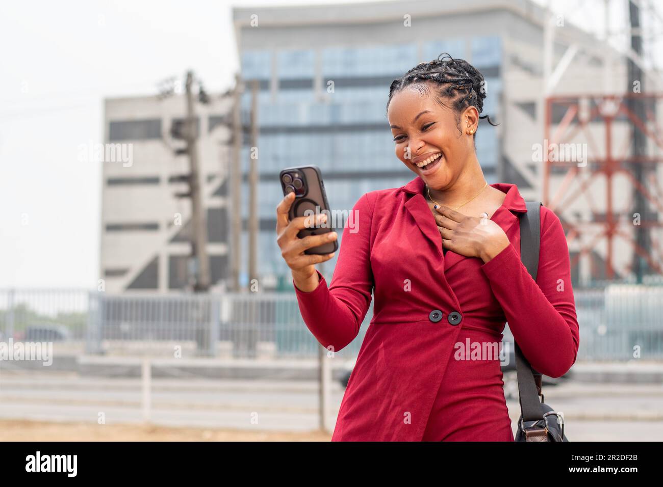 Excited black lady holding hi-res stock photography and images - Alamy