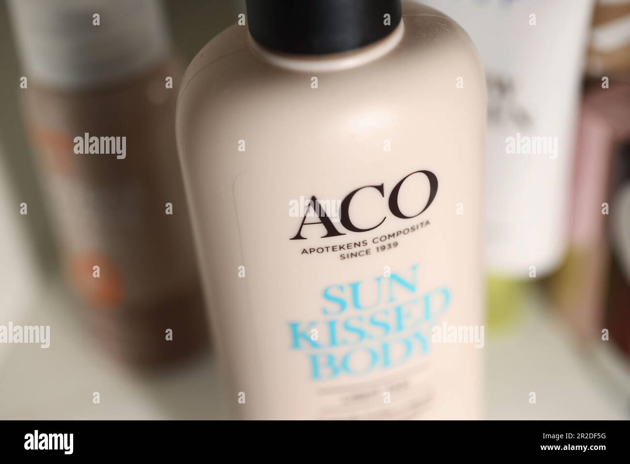 Different kinds of products in a bathroom, Aco sun kissed body lotion ...