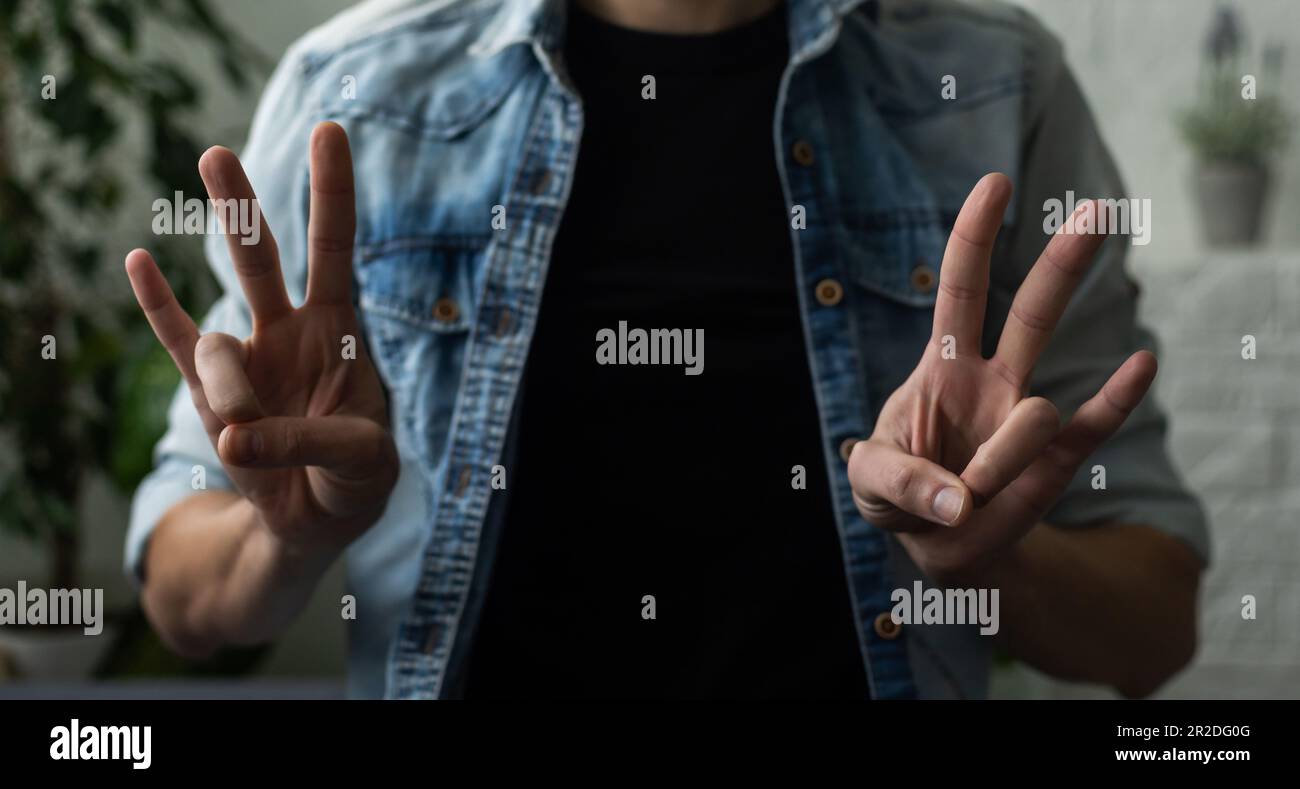 Adult Learning Sign Language For Deaf Disabled Stock Photo - Alamy