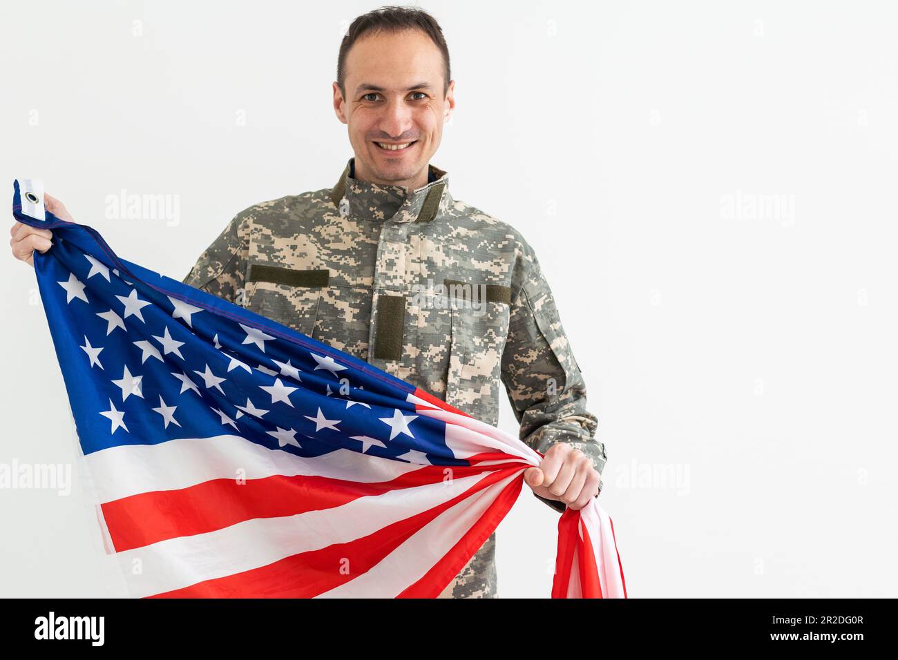 Army soldier holding stars and stripes national flag hi-res stock ...