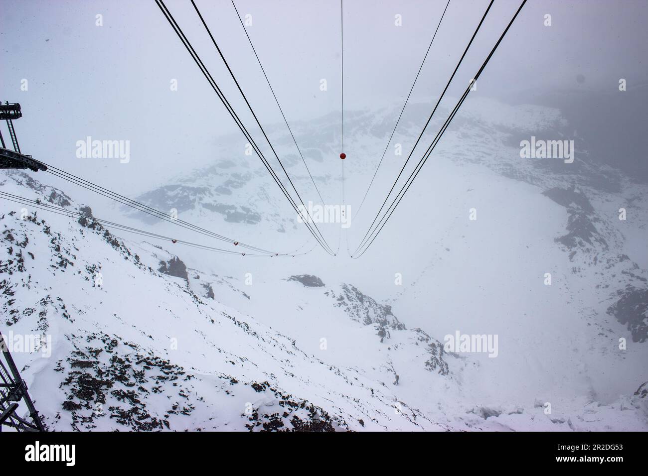 A majestic gondola ascends the Matterhorn Glacier Paradise, nestled ...
