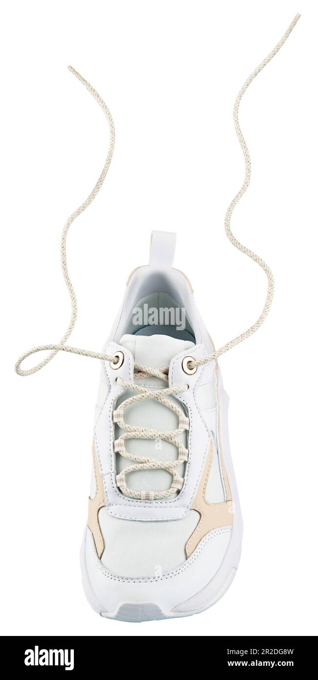 White sneaker with flying laces stands on the tip isolated on white ...
