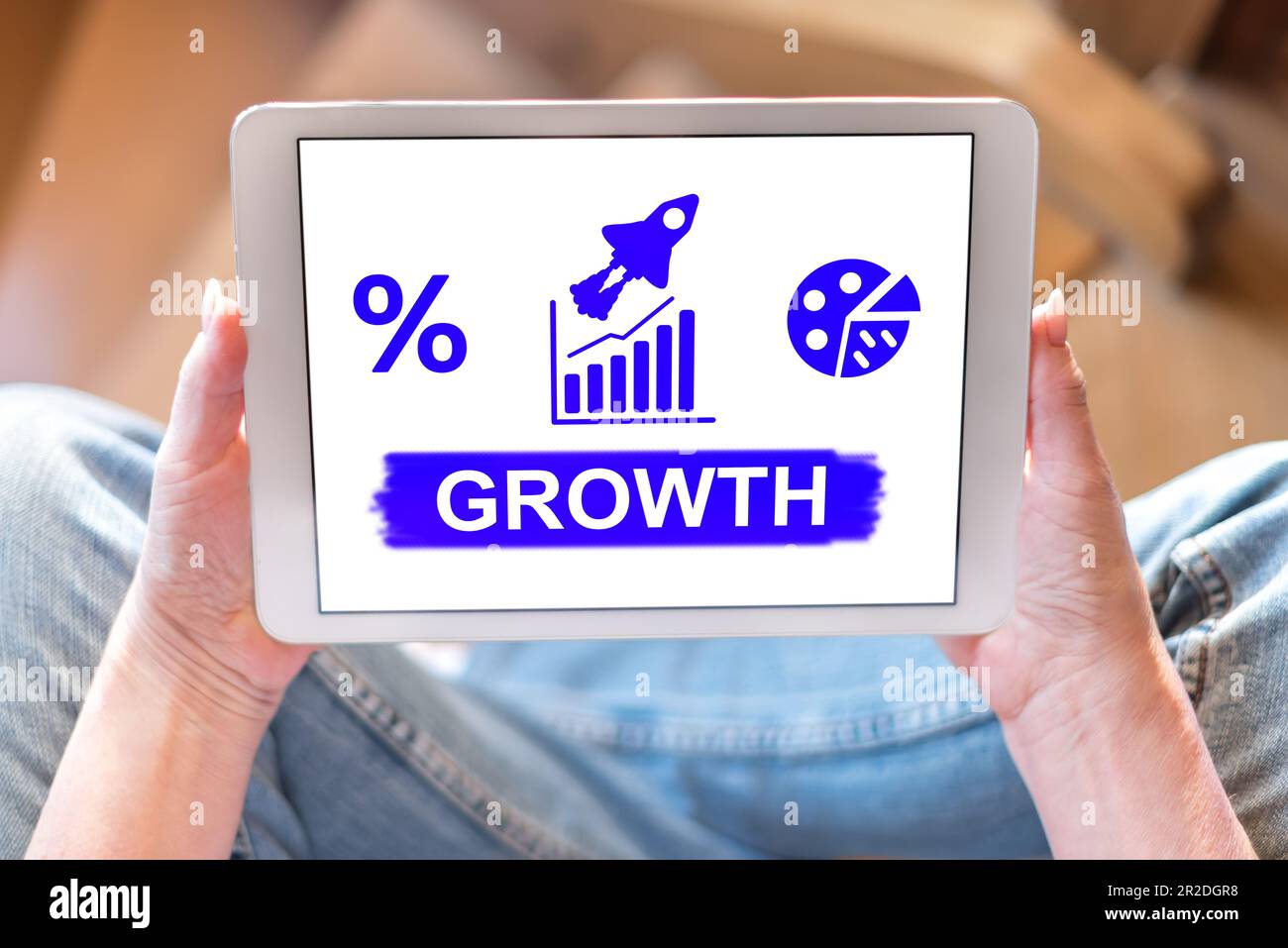 Tablet screen displaying a growth concept Stock Photo - Alamy