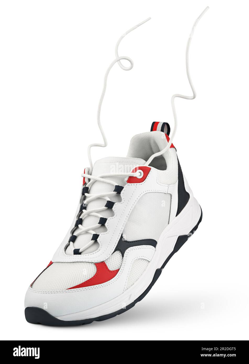 White sneaker with flying laces stands on the tip isolated on white ...