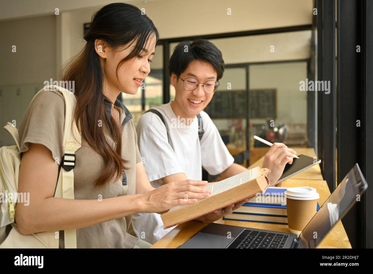 University students collaborating on a project in campus. Education, Learning and technology ...