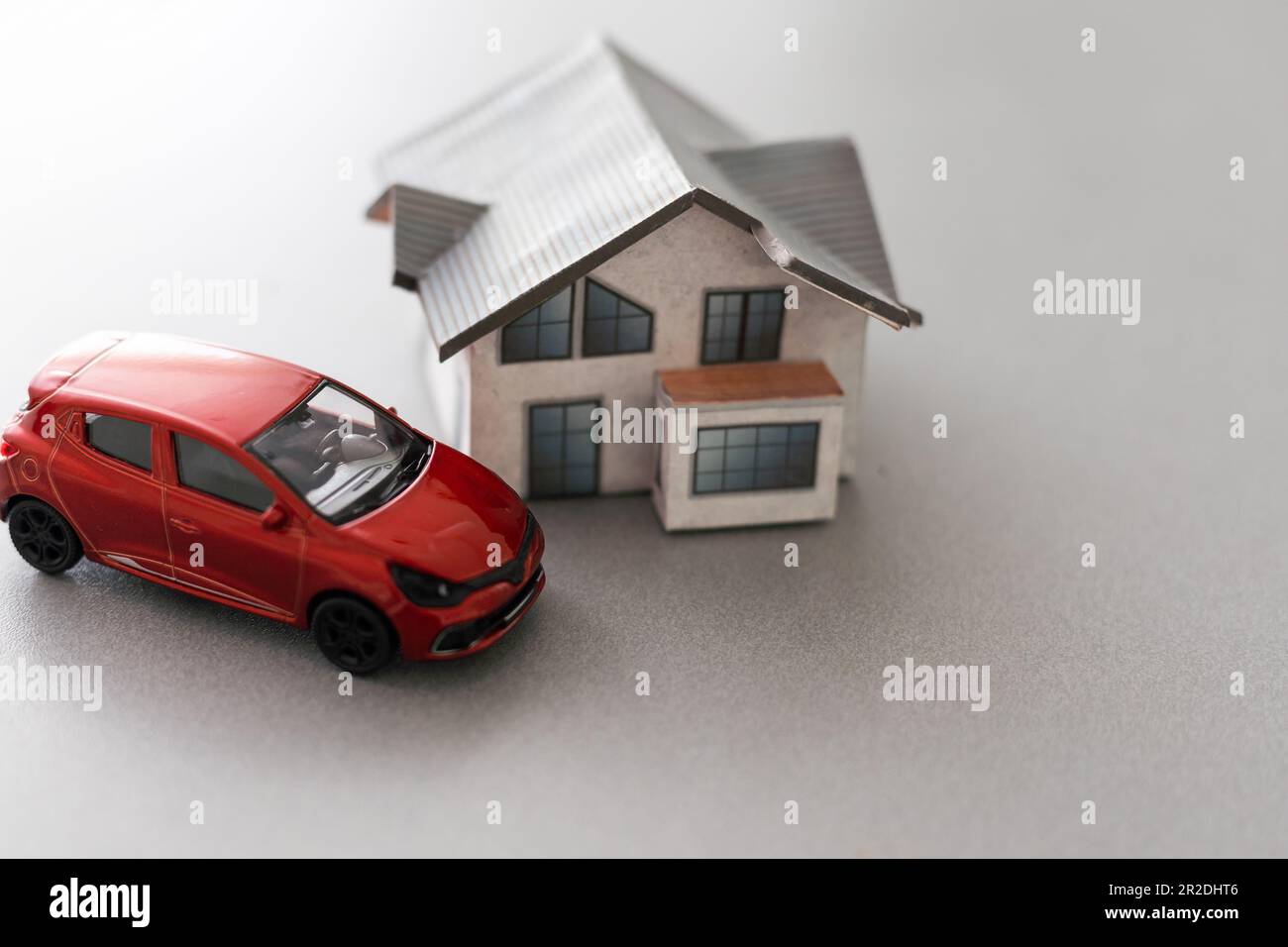 Home and car artificial on the concrete Stock Photo - Alamy