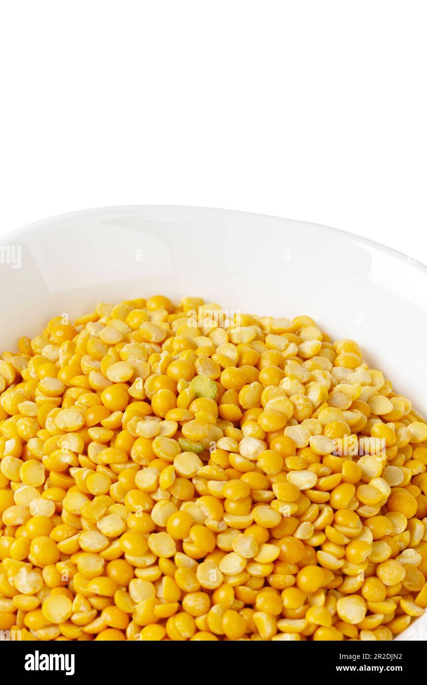Dry yellow split peas isolated on white Stock Photo - Alamy