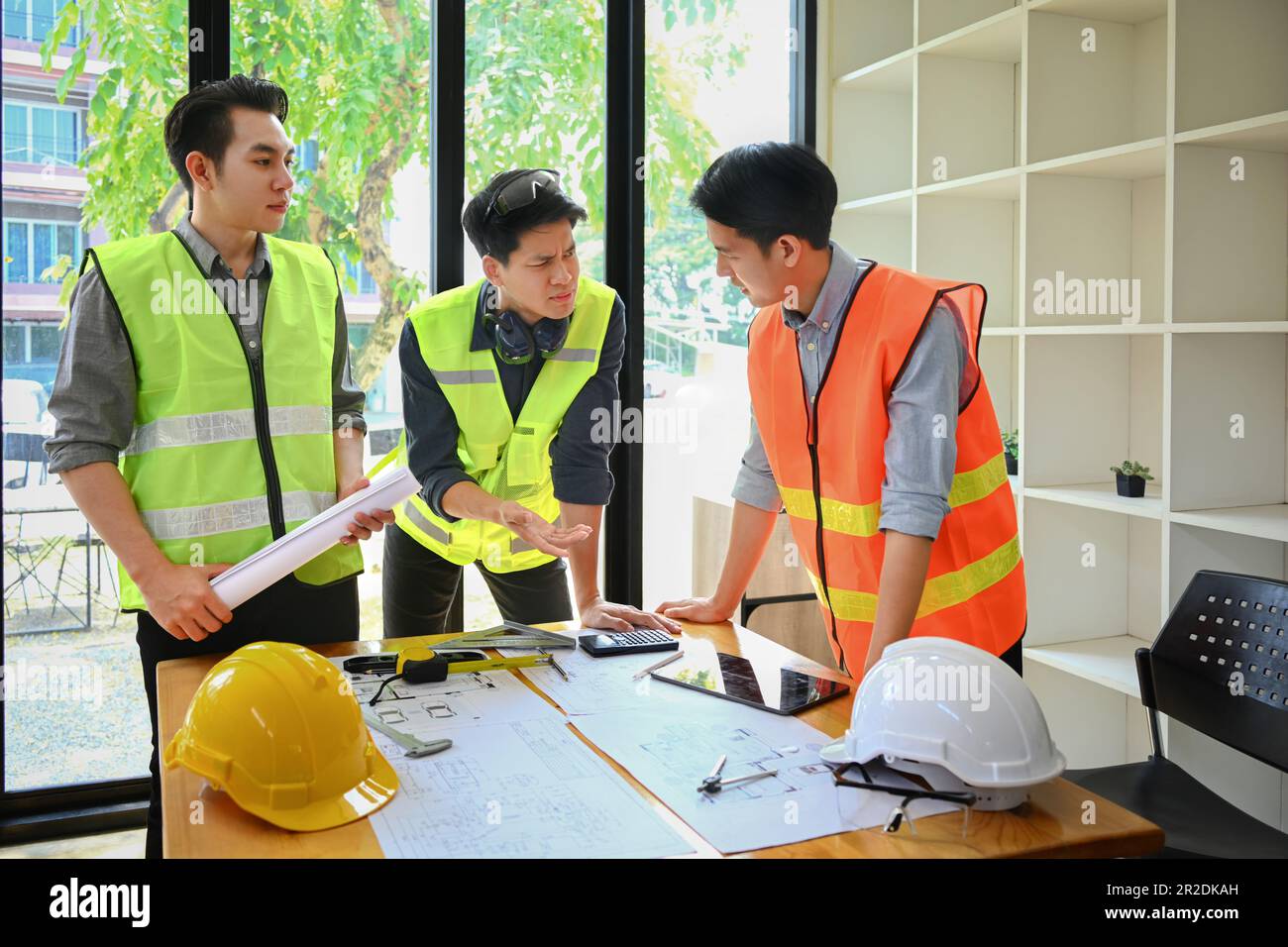 Architect team brainstorming, planning development details at ...